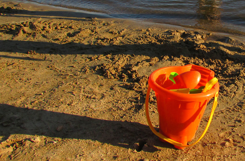 Kids orange sand bucket on beach - Free stock photos, images ...